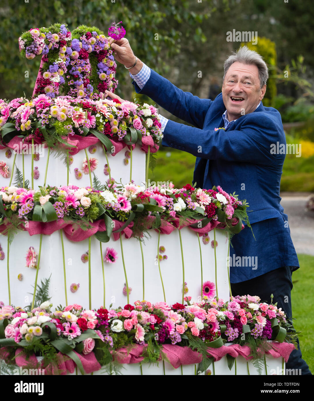 TV gardener Alan Titchmarsh adds the finishing touches to a giant three ...