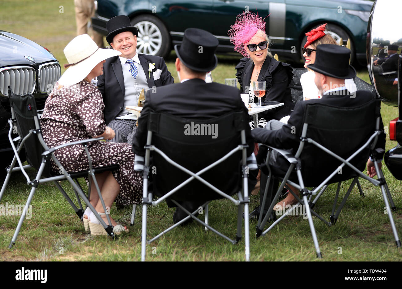 Racegoers enjoy a picnic outside their cars during day three of Royal ...