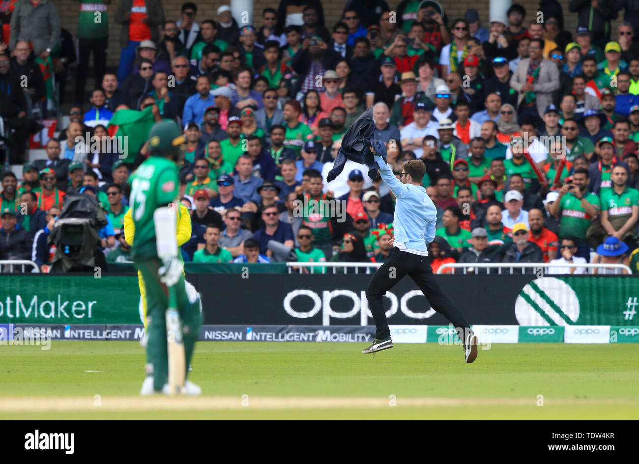 A pitch invader interrupts play hi-res stock photography and images - Alamy
