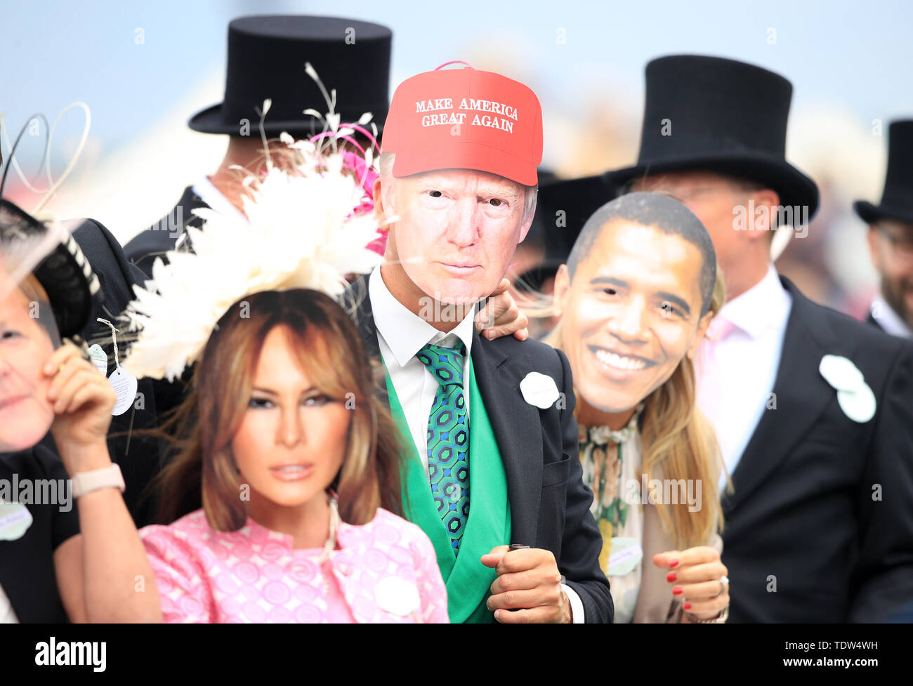 Racegoers wearing masks of politicians including Donald Trump and ...