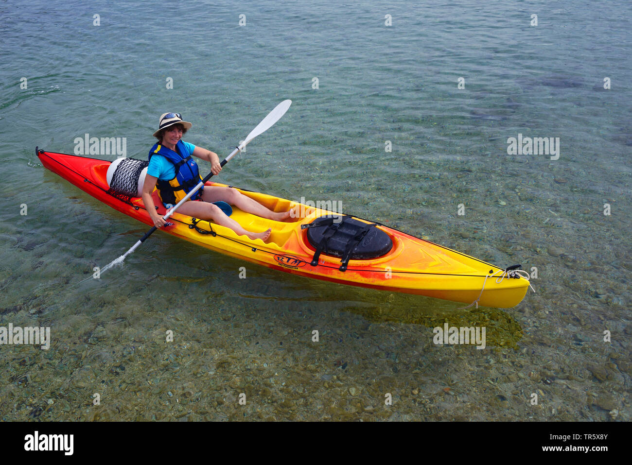 Sea kayaking near the coast, France, Corsica, Agriates, Saint-Florenz ...