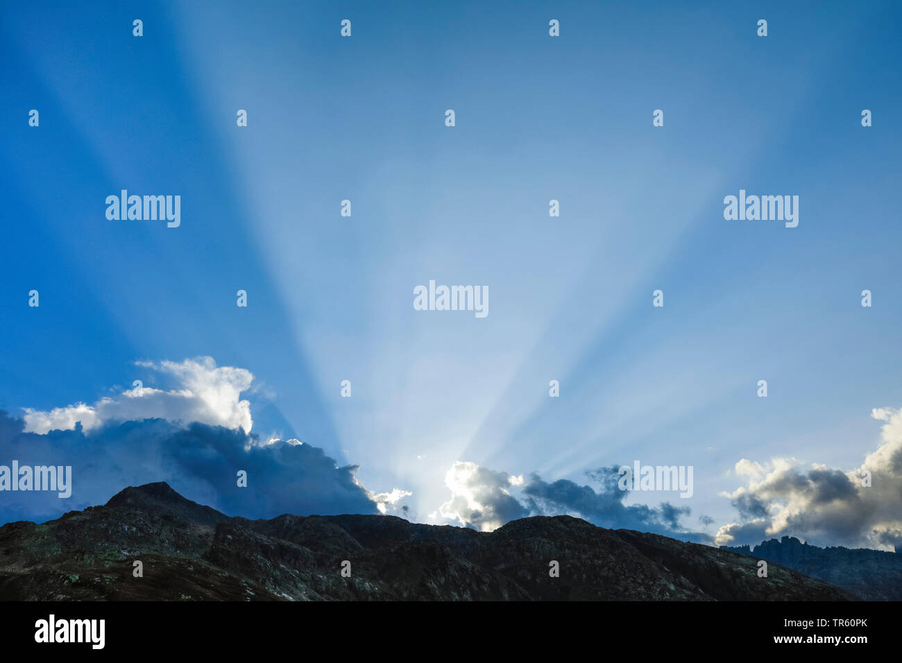 sunbeams breaking through the clouds, Switzerland Stock Photo - Alamy