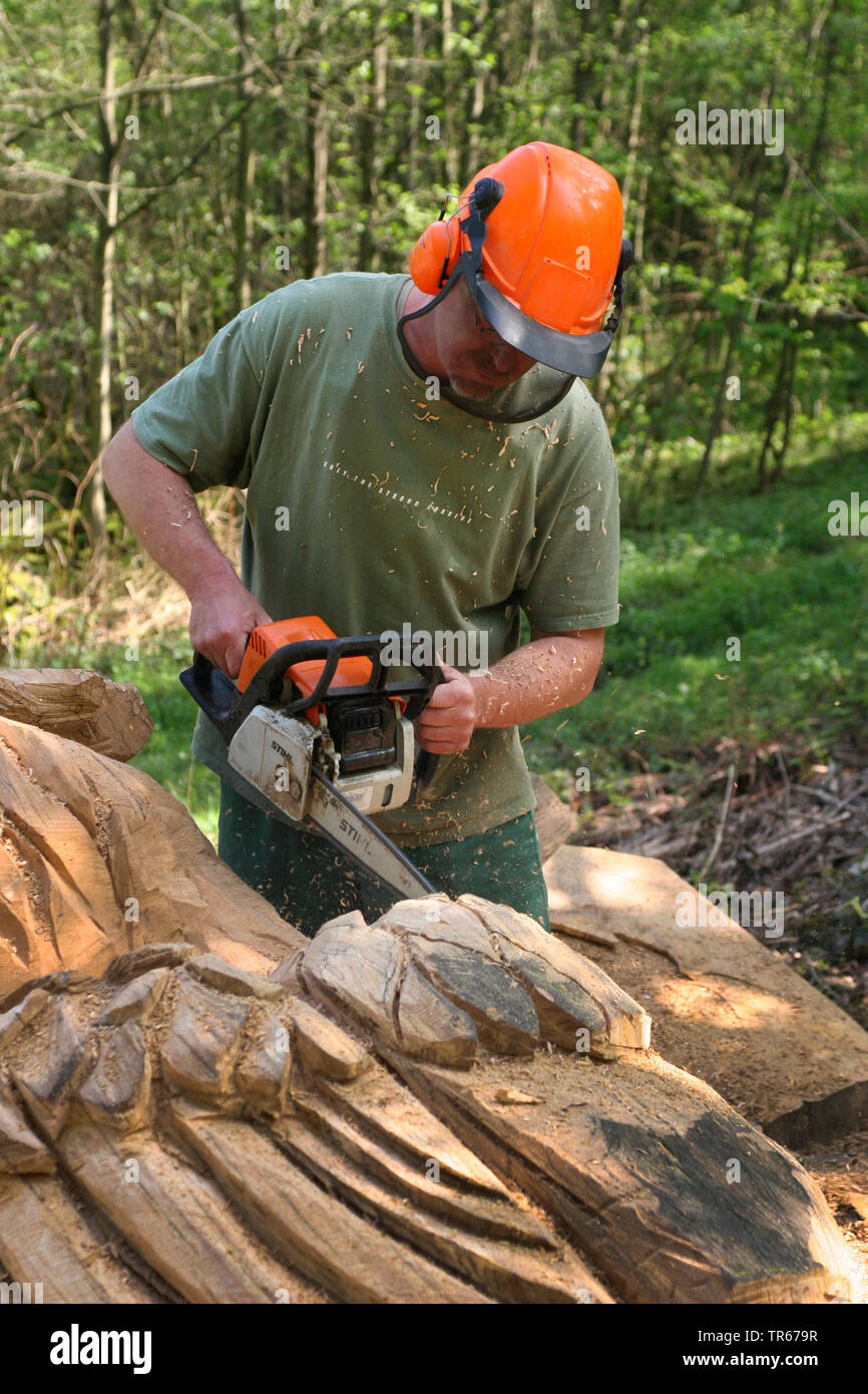 lumberman with power saw, Germany Stock Photo - Alamy
