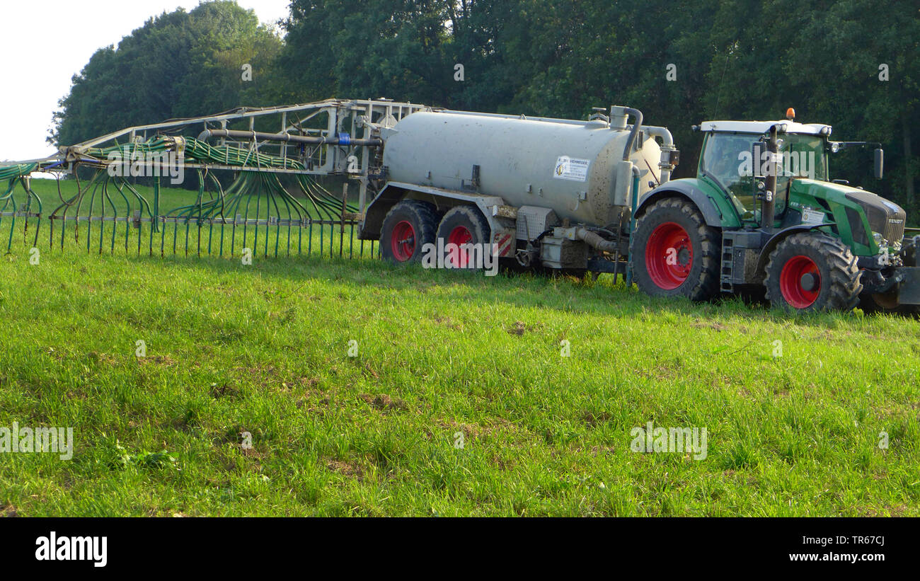 liquid manure trailers manuring a meadow with liquid manure, Germany ...