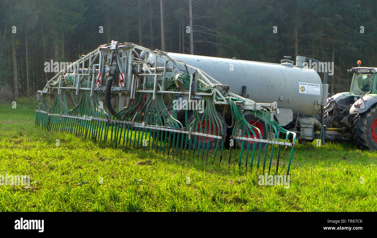 liquid manure trailers manuring a meadow with liquid manure, Germany ...