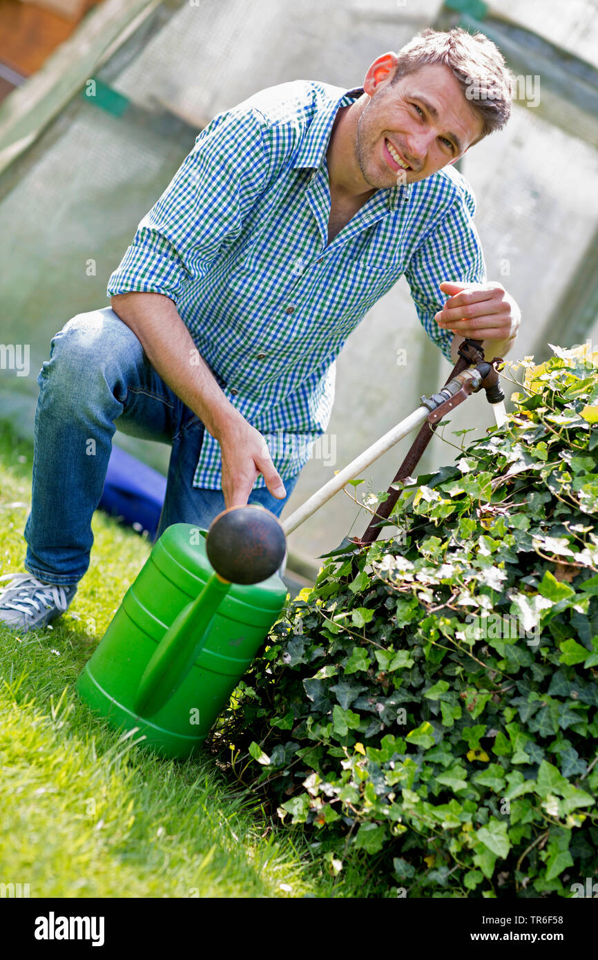 Filling water pot hi-res stock photography and images - Alamy