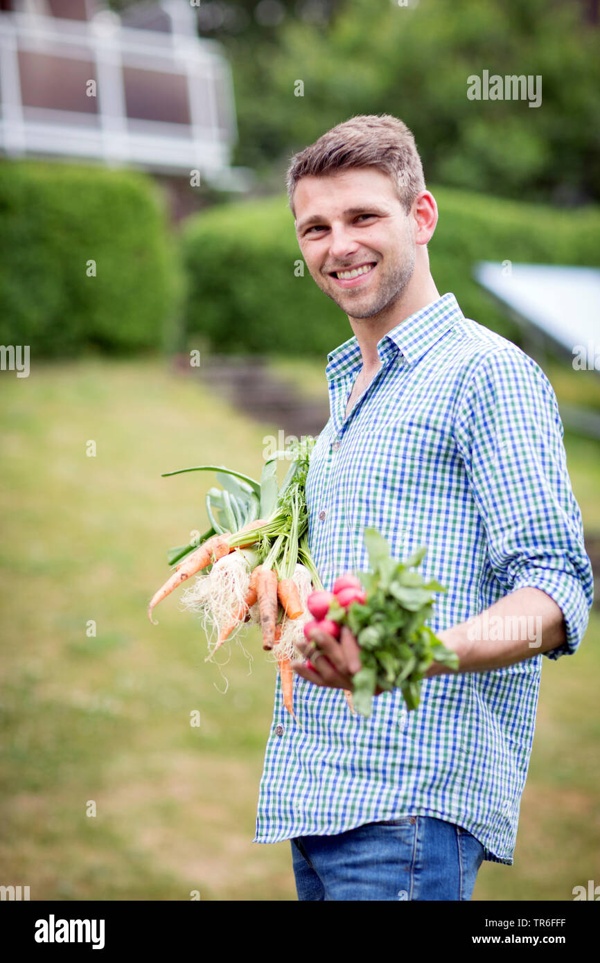 man with fresh vegetables from the garden, Germany Stock Photo - Alamy