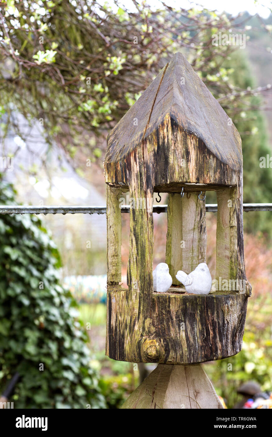 wooden aviary and bird sculptures as garden decoration, Germany Stock ...