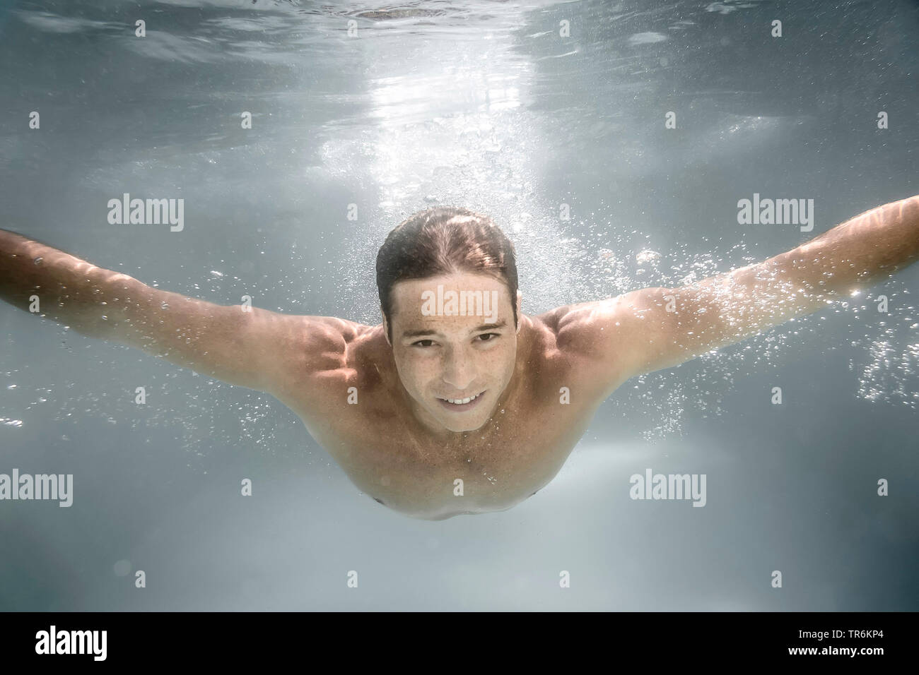 young man diving in a swimming pool, Germany Stock Photo - Alamy