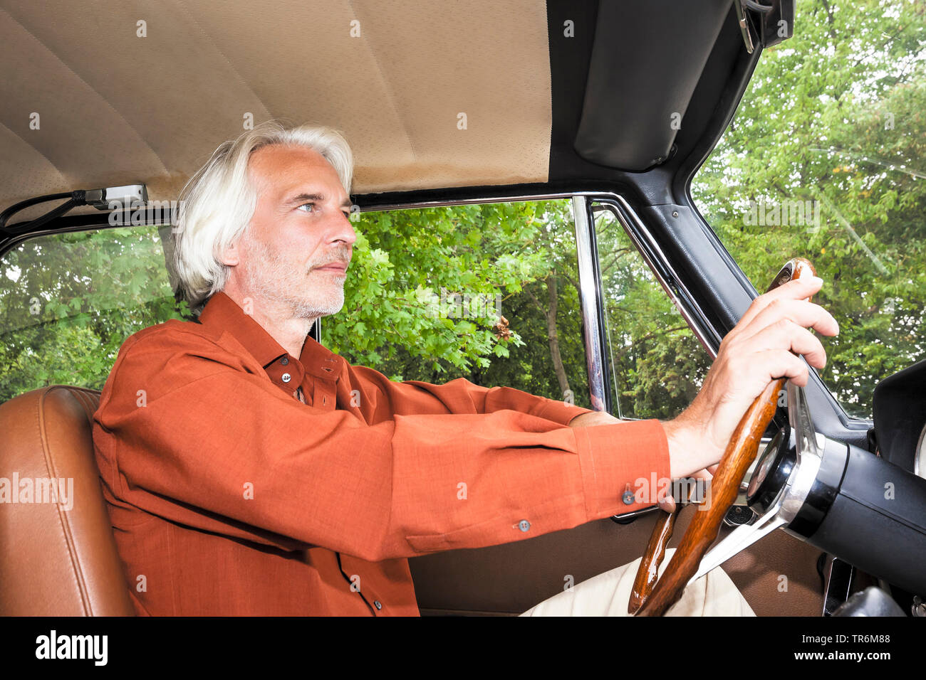 senior sitting in his oldtimer Stock Photo - Alamy