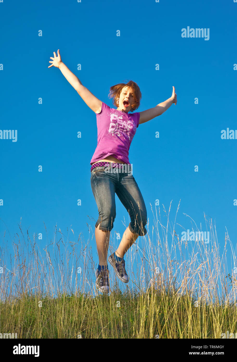 young girl jumping Stock Photo - Alamy