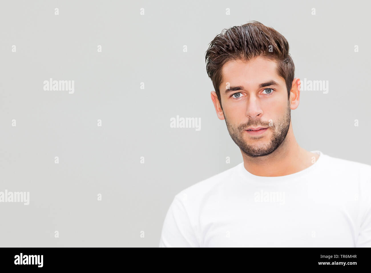 young attractive man in a white T-Shirt, portrait, Germany Stock Photo ...