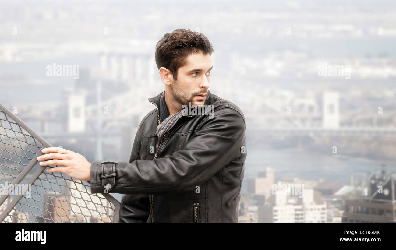 young attractive man with leather jacket in the city, Germany Stock ...