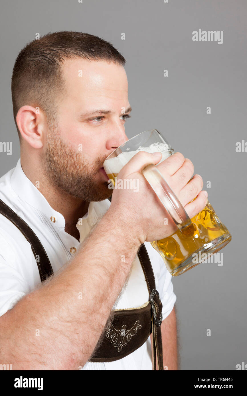 traditional bavarian man drinking mass beer, Germany, Bavaria Stock ...