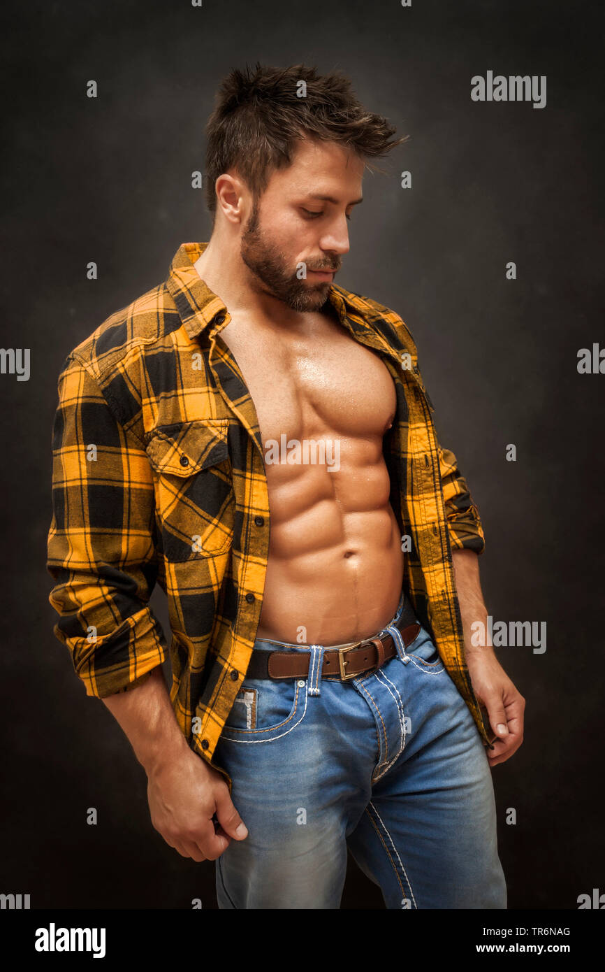 young beefy man in open shirt, showing his muscular body, Germany Stock ...