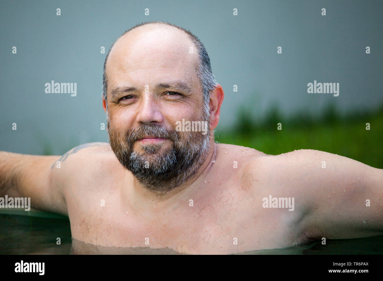 man relaxing in the pool, Germany Stock Photo - Alamy