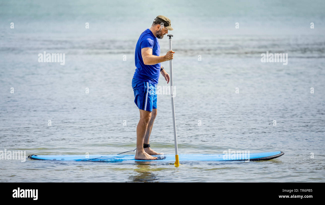Man paddles sup board in hi-res stock photography and images - Alamy