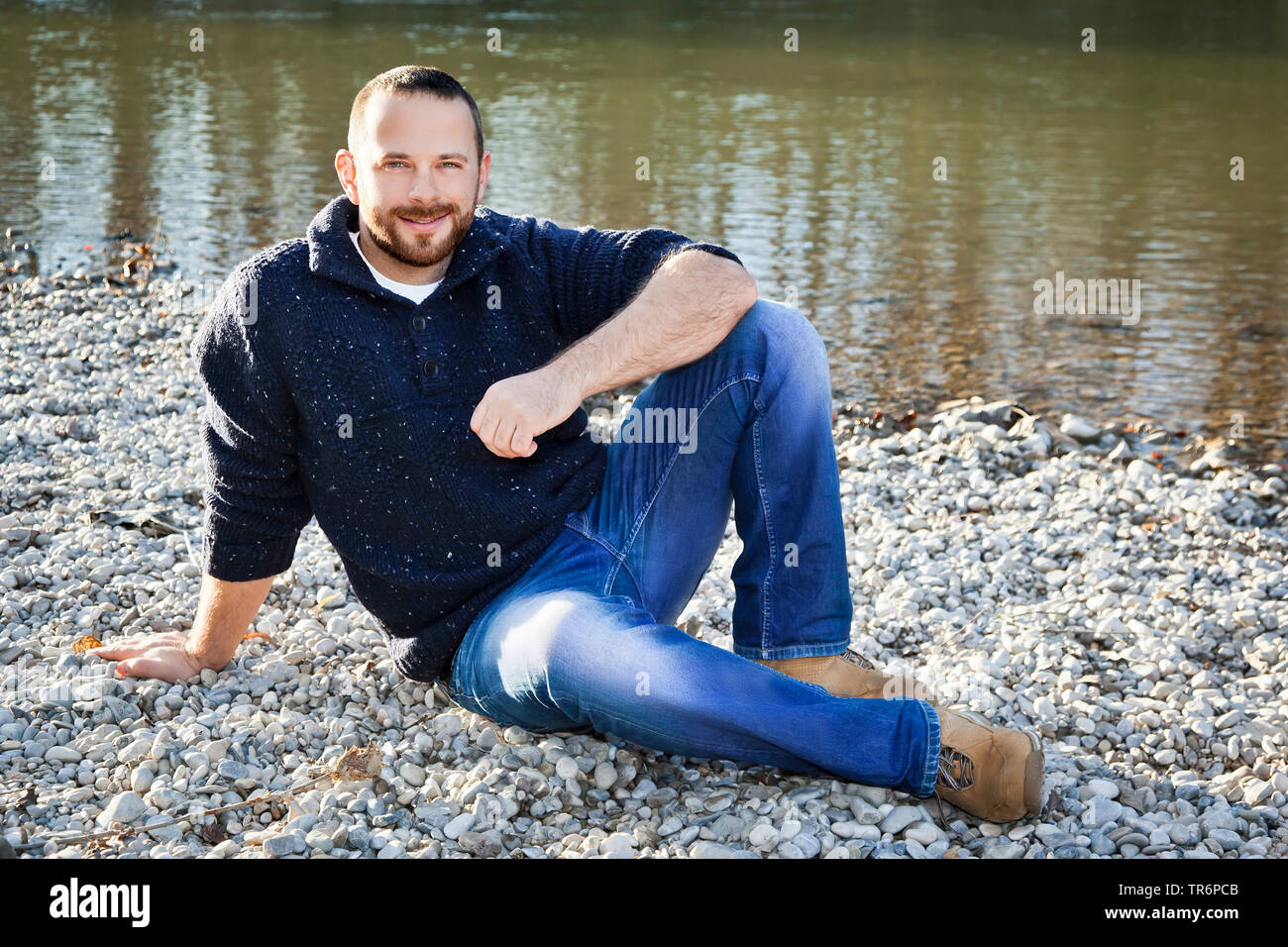 Handsome young man at waterfront hi-res stock photography and images ...