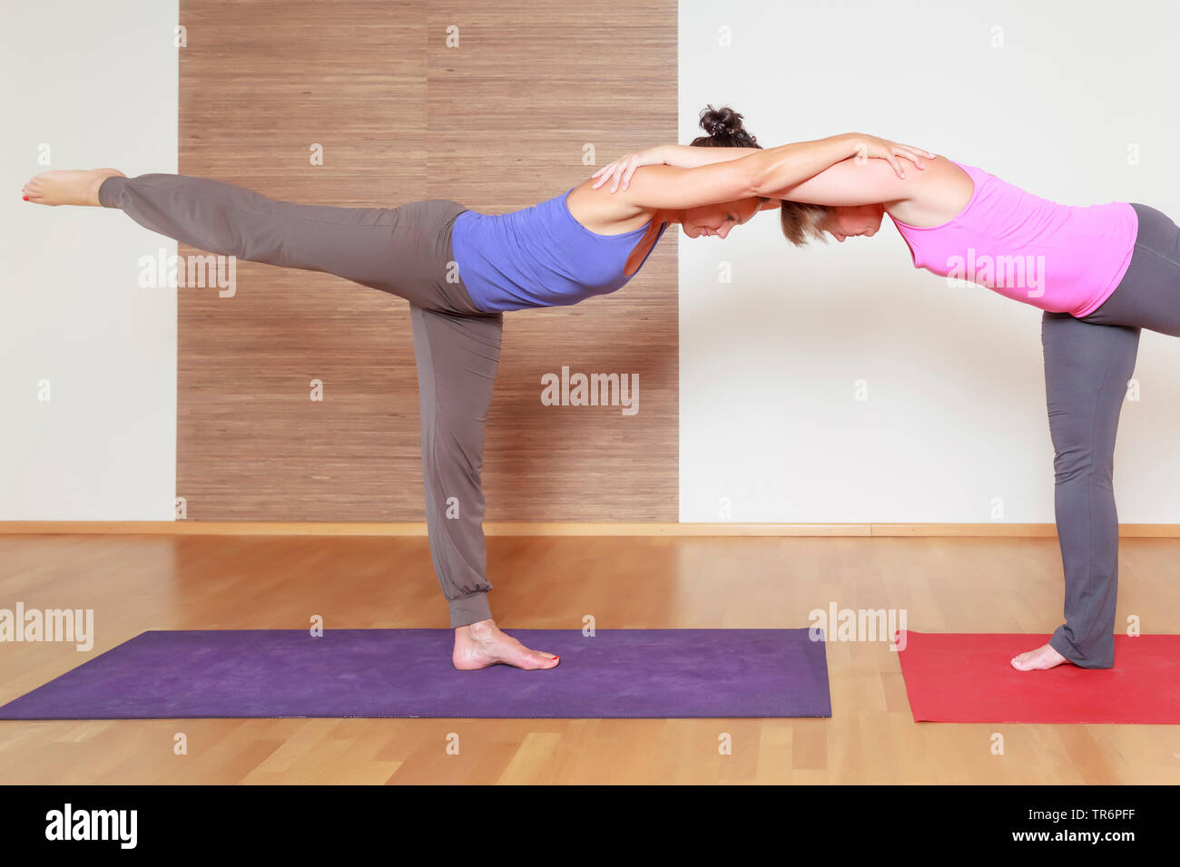 two women doing yoga in the living room at home Stock Photo - Alamy