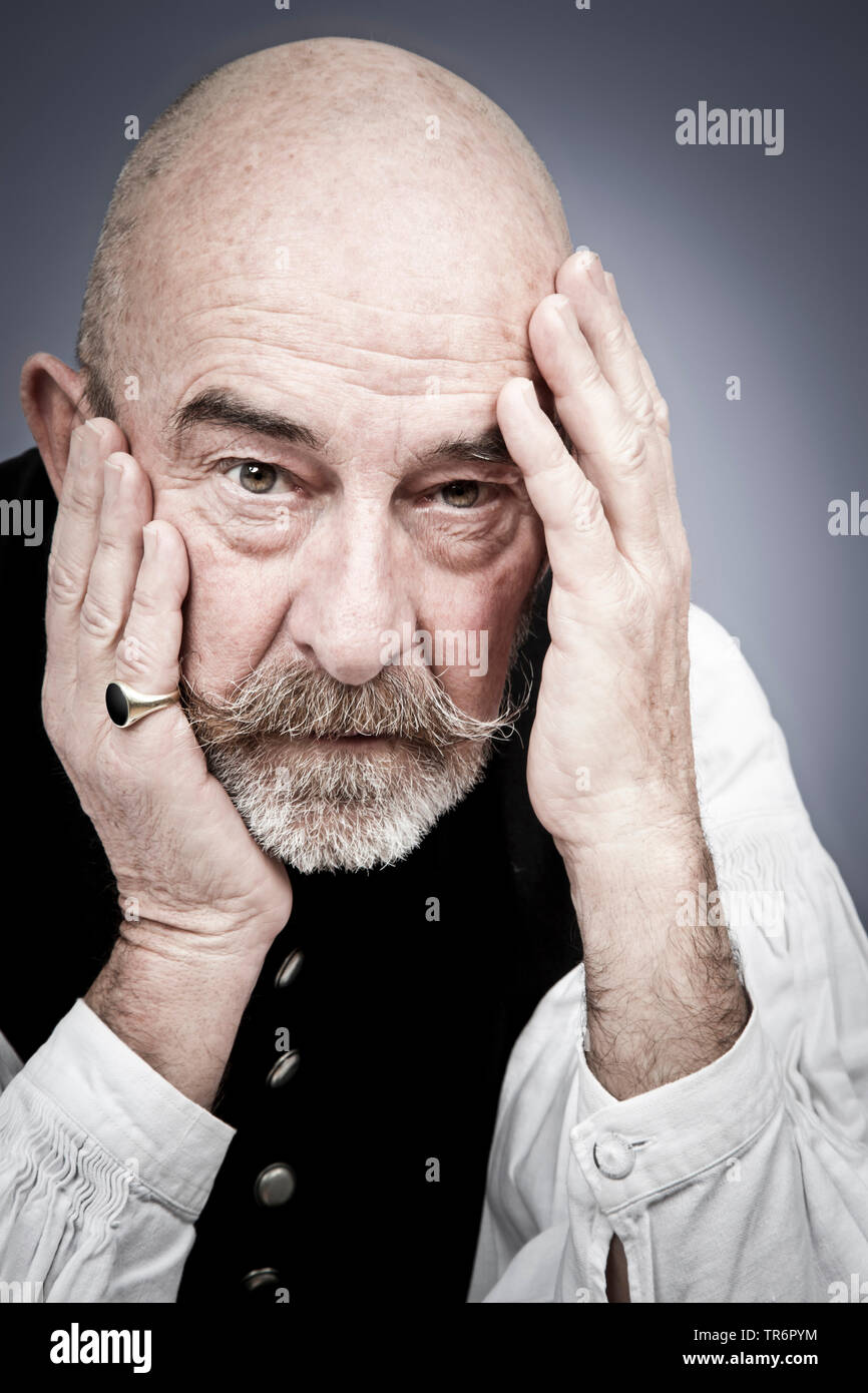 old man with bald head and grey beard looking aghast and putting his ...