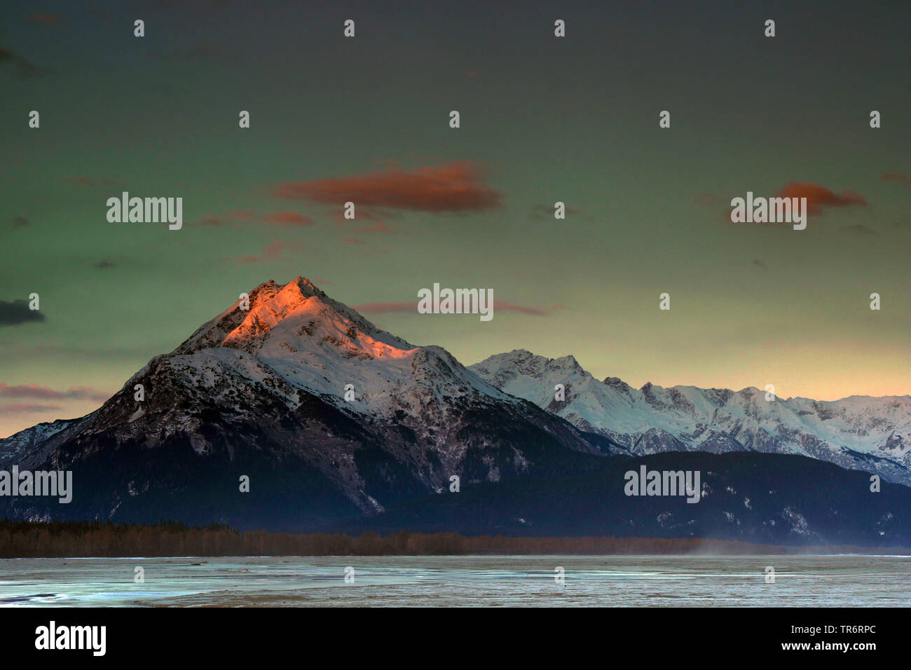 mountain landscape in winter with alpenglow at Chilkoot River, USA ...