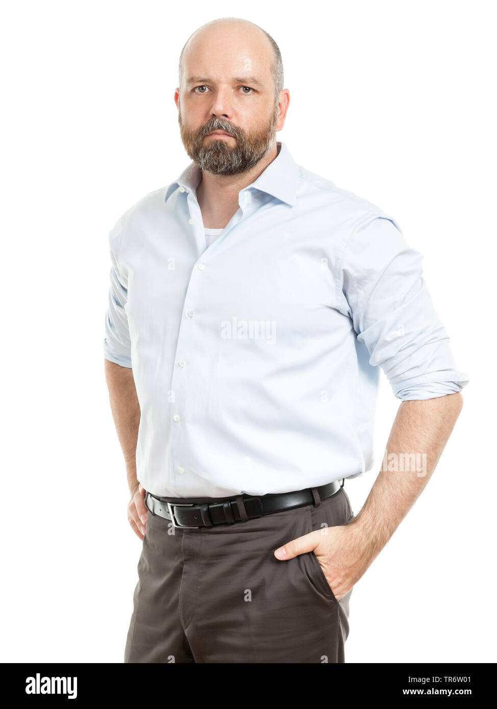 Confident middle-aged businessmann standing with arms tucked in his ...