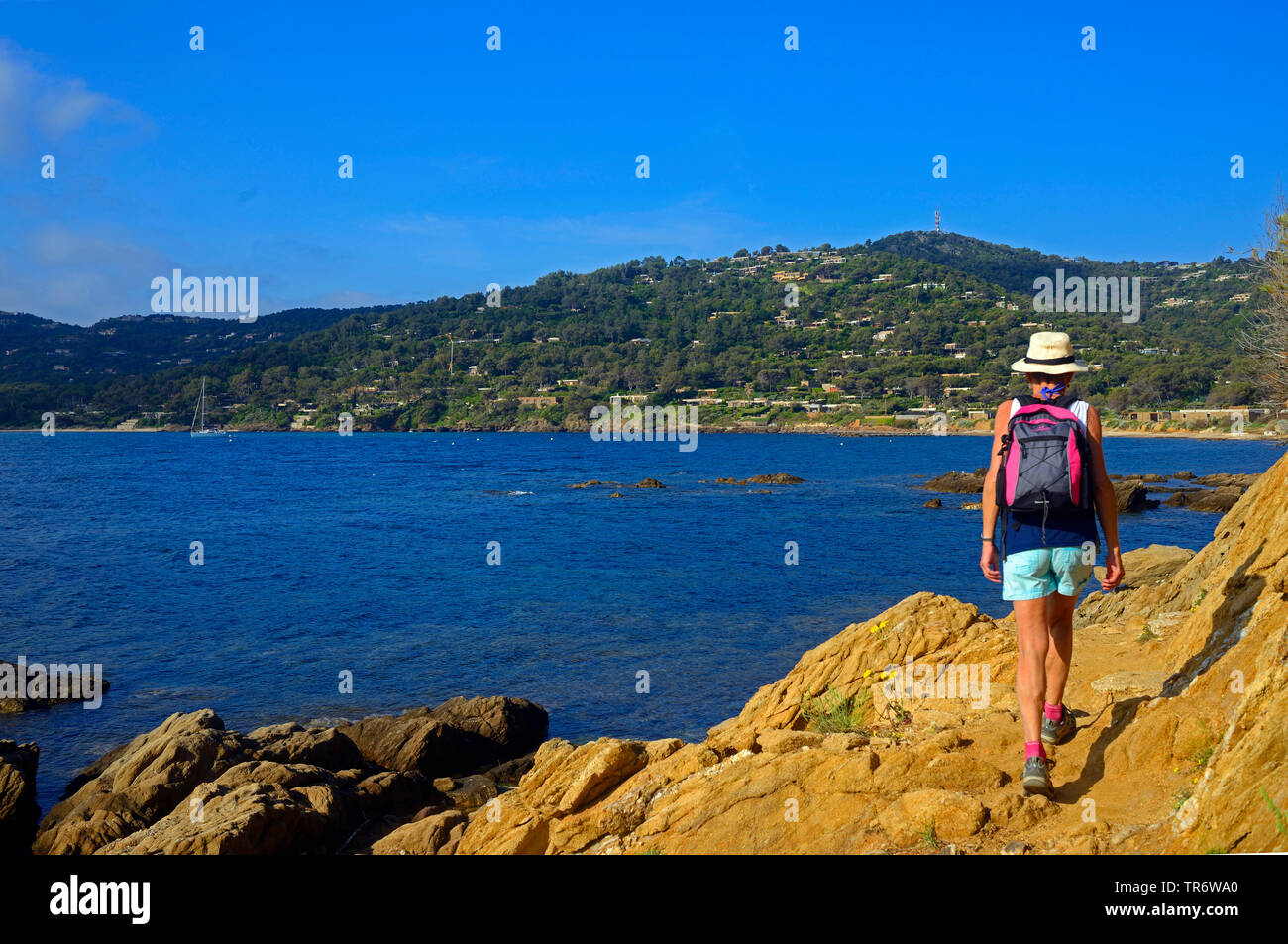 female wanderer at the rocky coast to Cap Benat, France, Lavandou Stock ...