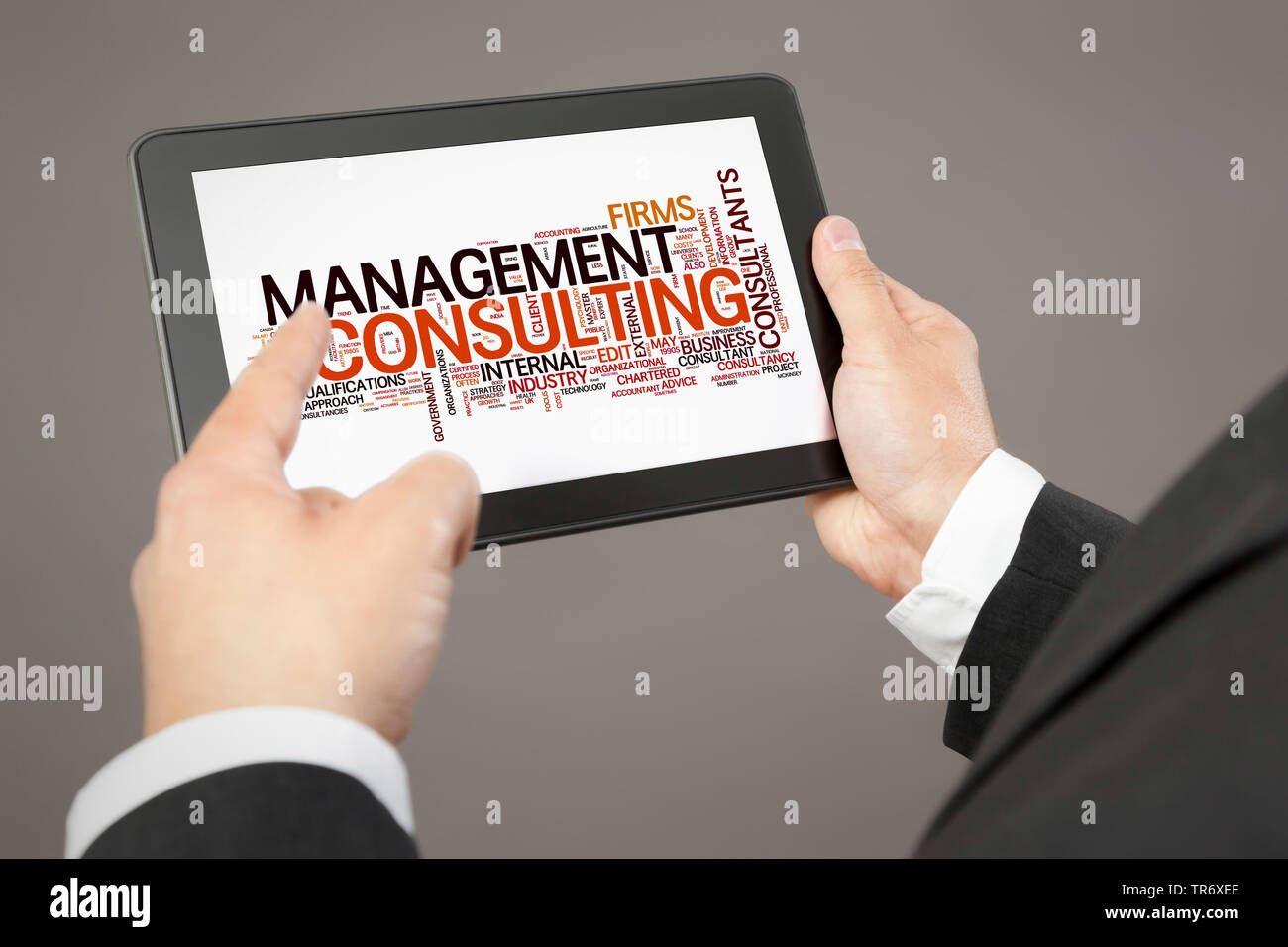 3D computer graphic, symbolised tablet computer reading MANAGEMENT ...