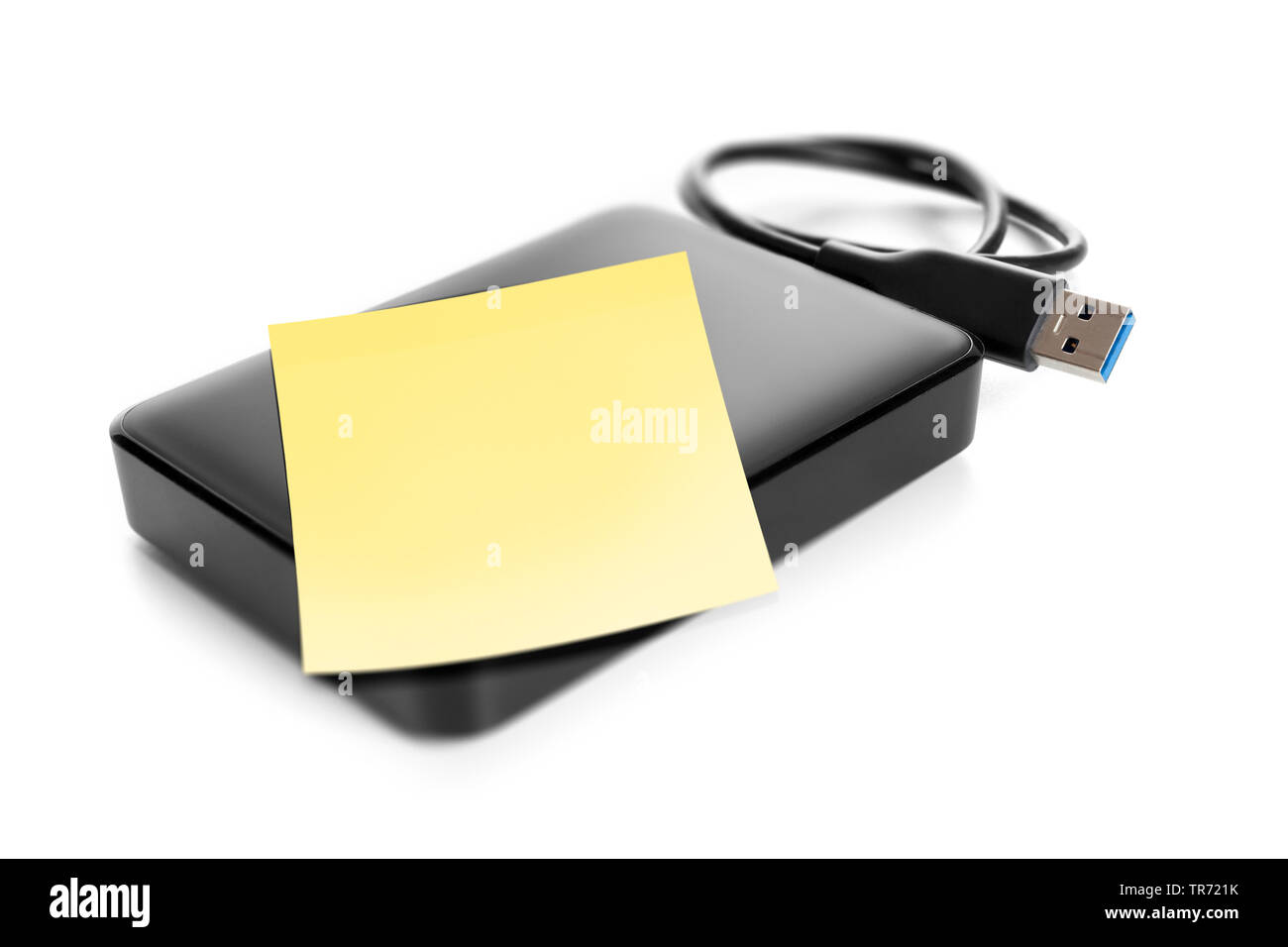 3D computer graphic, external USB harddrive with yellow post-it without ...