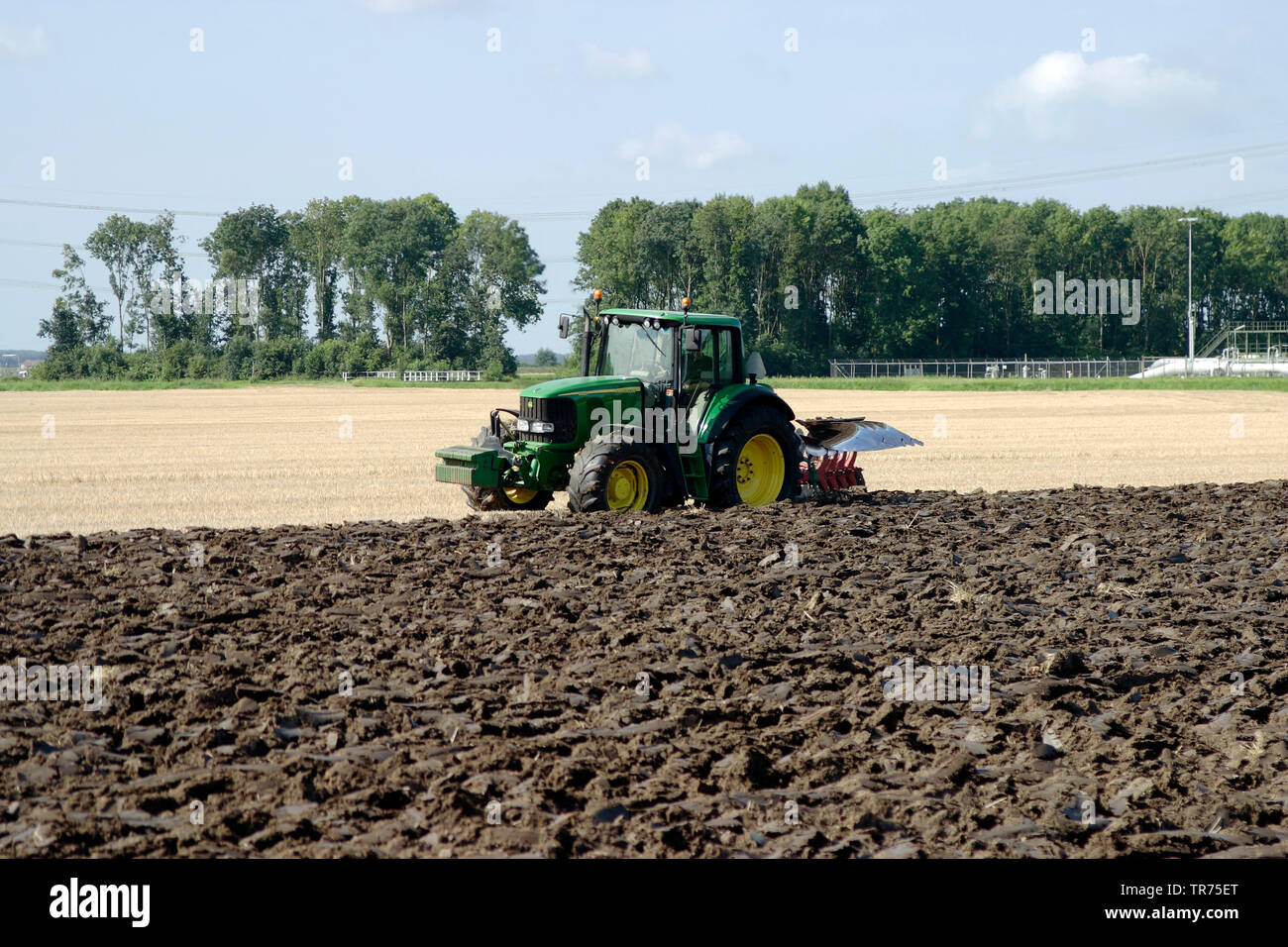 ploughing a field, Netherlands Stock Photo - Alamy
