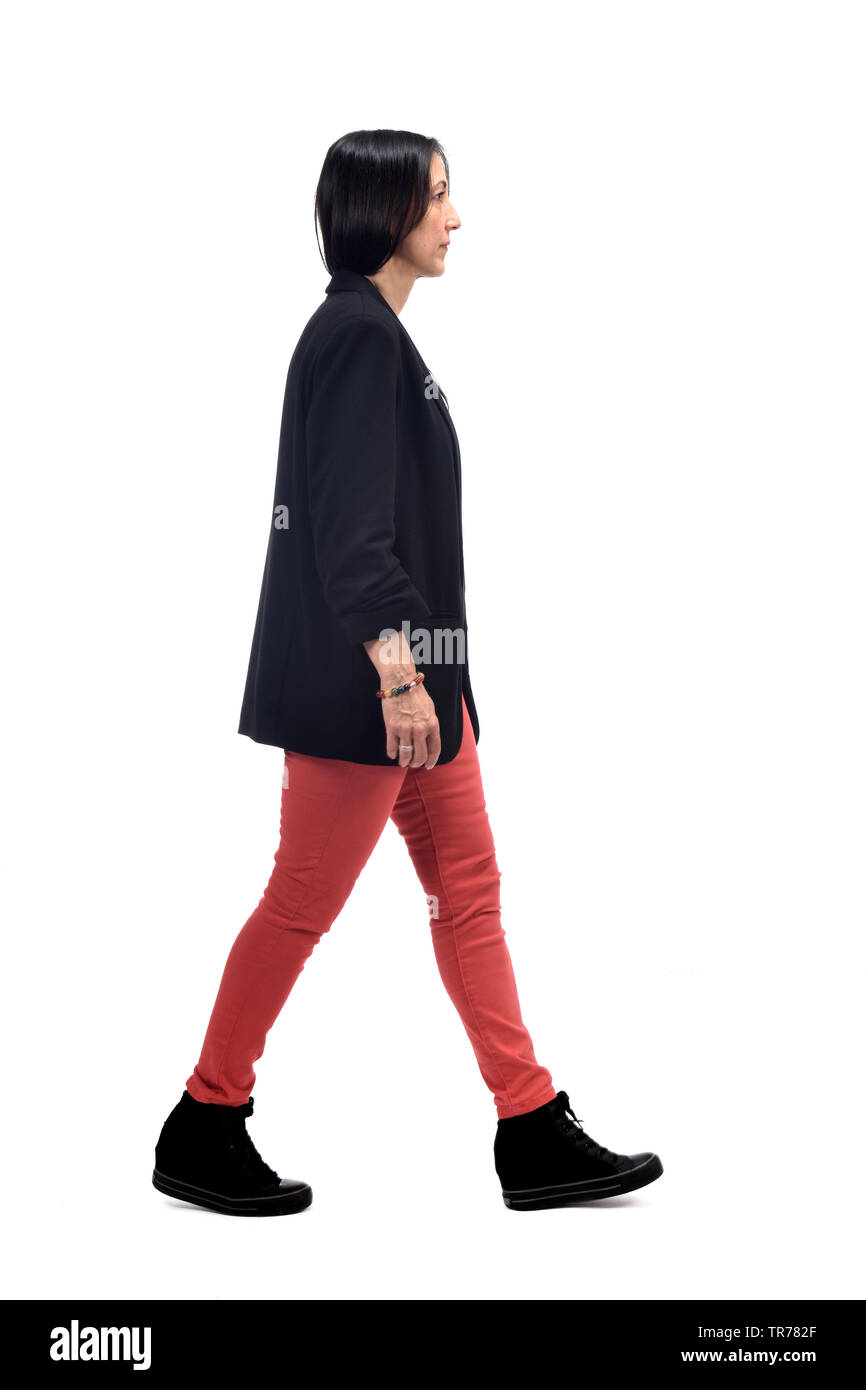 full portrait of middle aged woman walking on white Stock Photo - Alamy