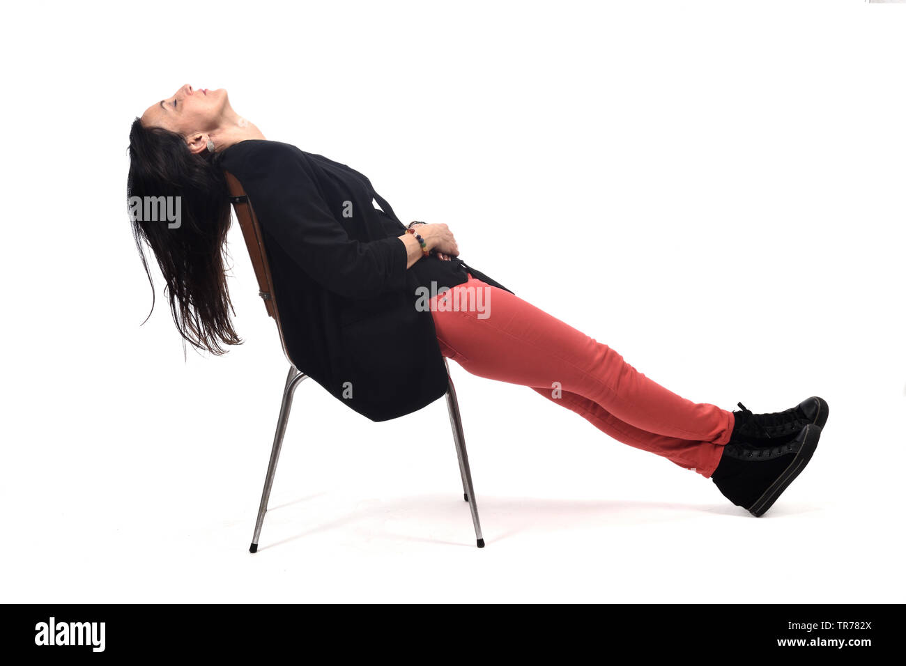 full portrait of a woman lying on a chair on white Stock Photo - Alamy