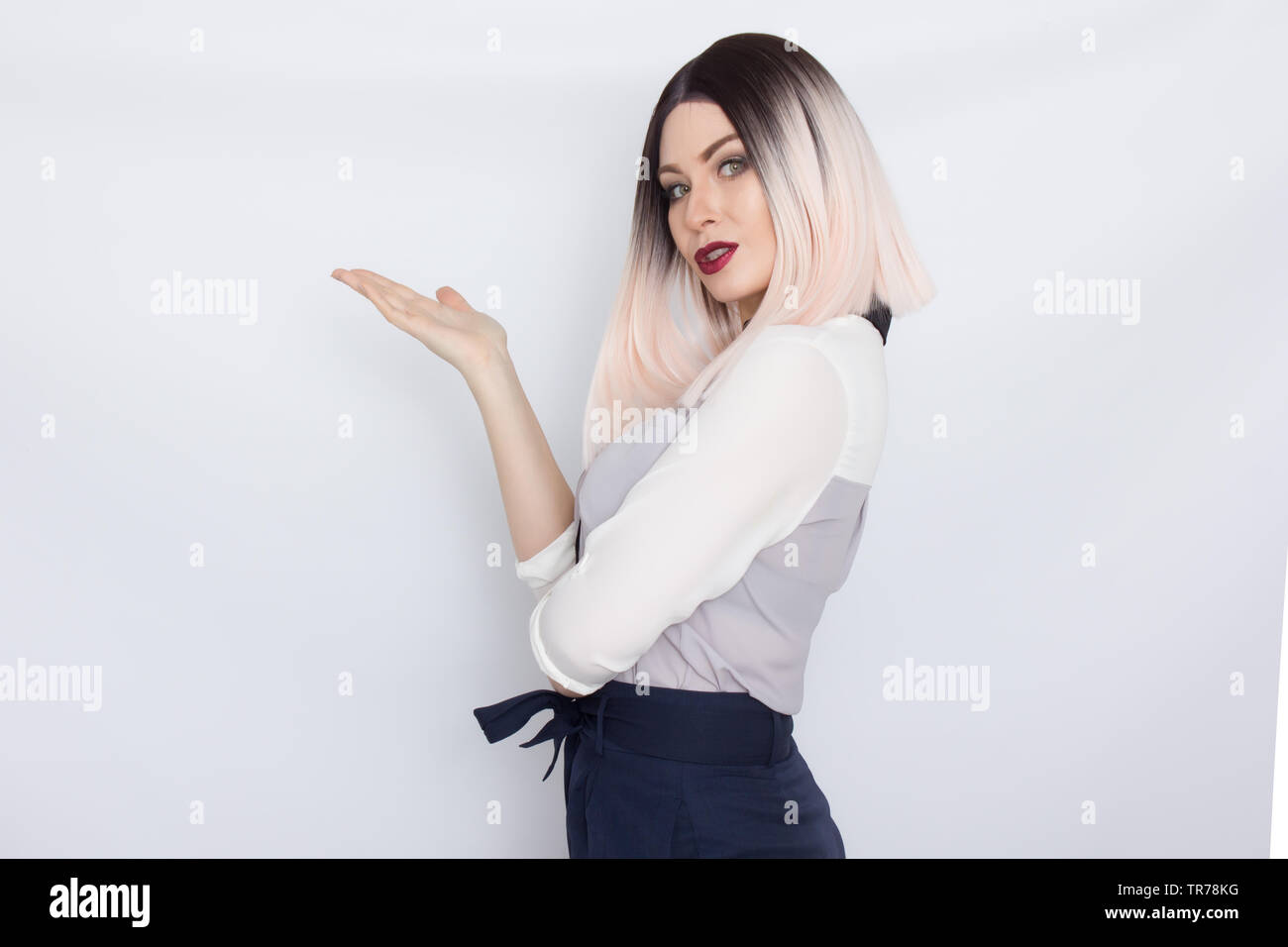 Image of successful blondhairy secretary woman standing in the office ...