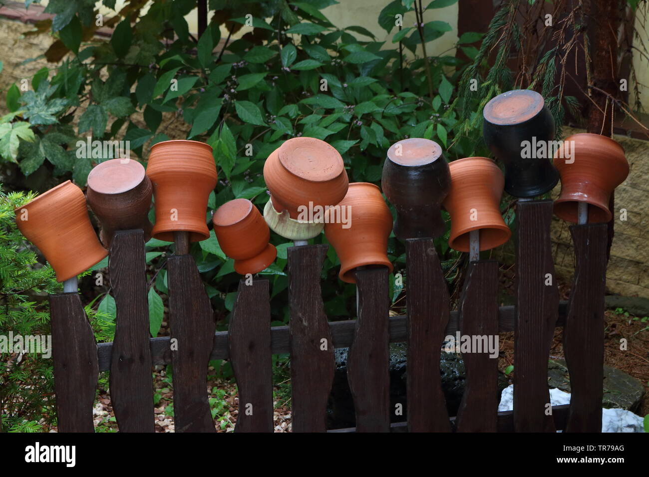 Clay pots decorate a wooden fence in the country Stock Photo - Alamy