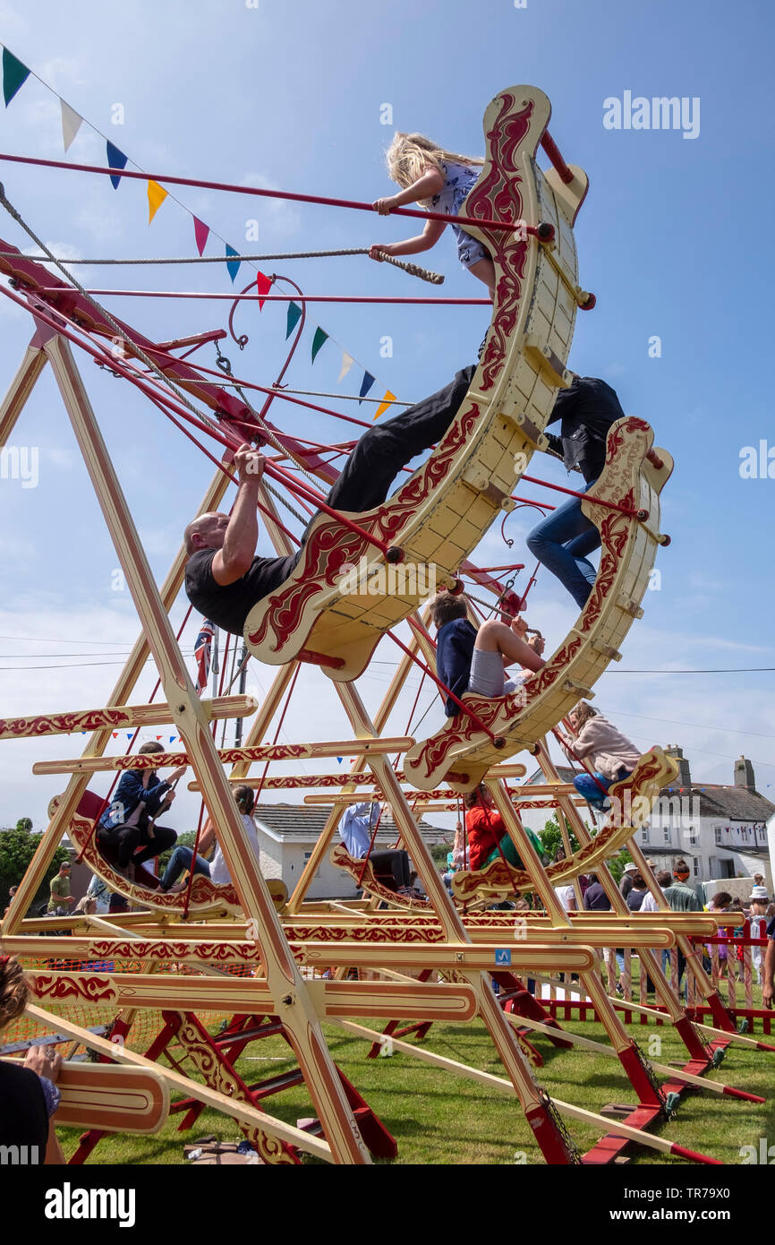 Old fashioned fairground rides at East Prawle fair, Devon Stock Photo ...