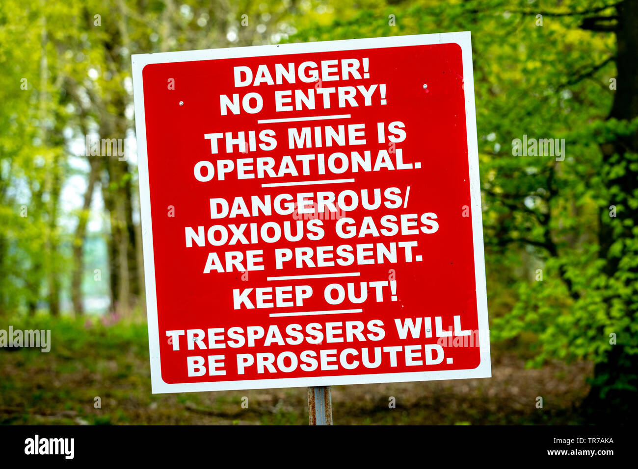 Signage announcing a danger to the public Stock Photo - Alamy