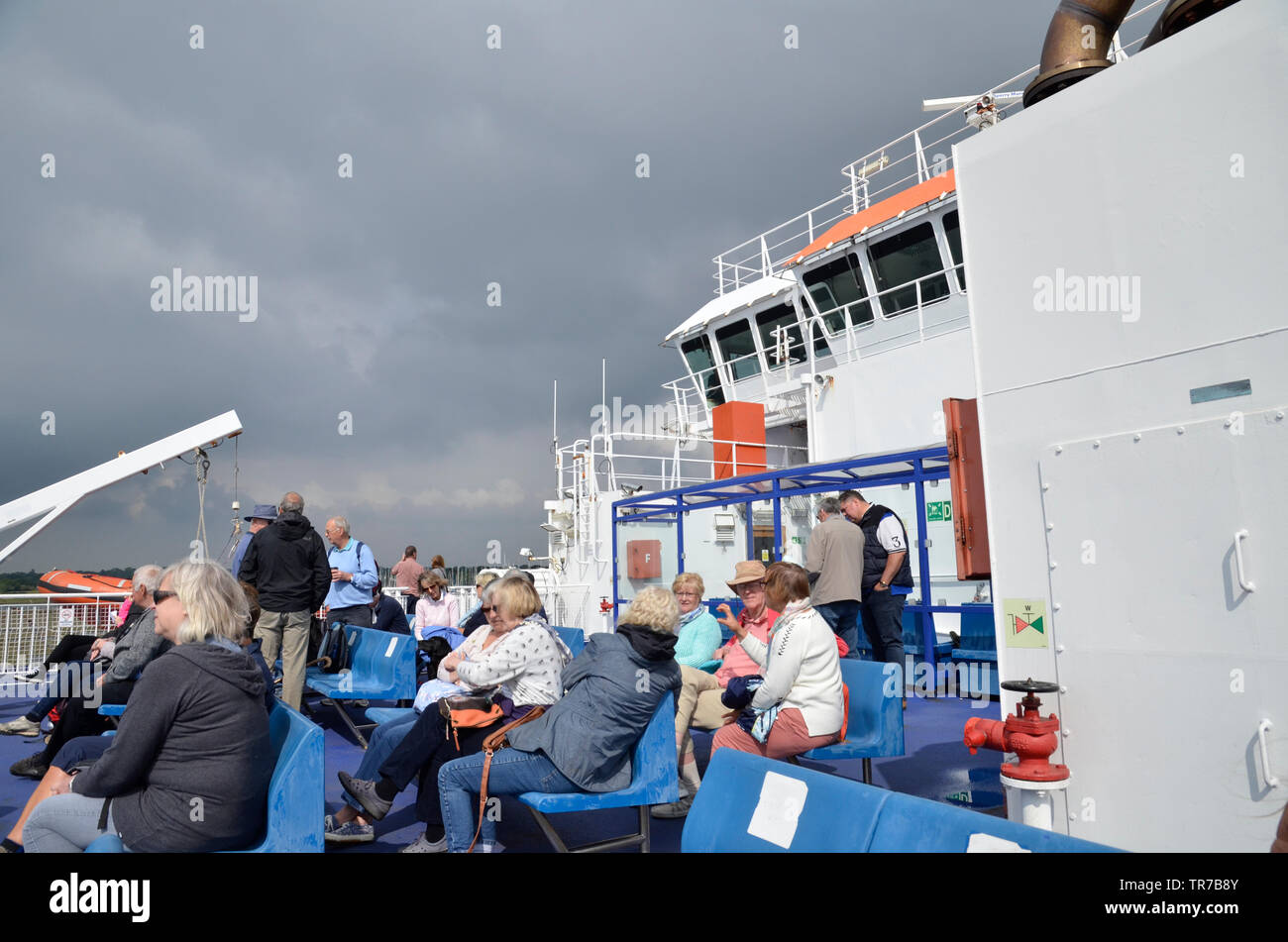 Passengers on a Wightlink ferry leaving the terminal at Lymington ...