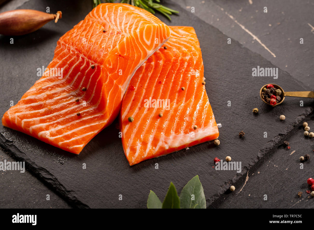 Two salmon fillet on slate Stock Photo - Alamy