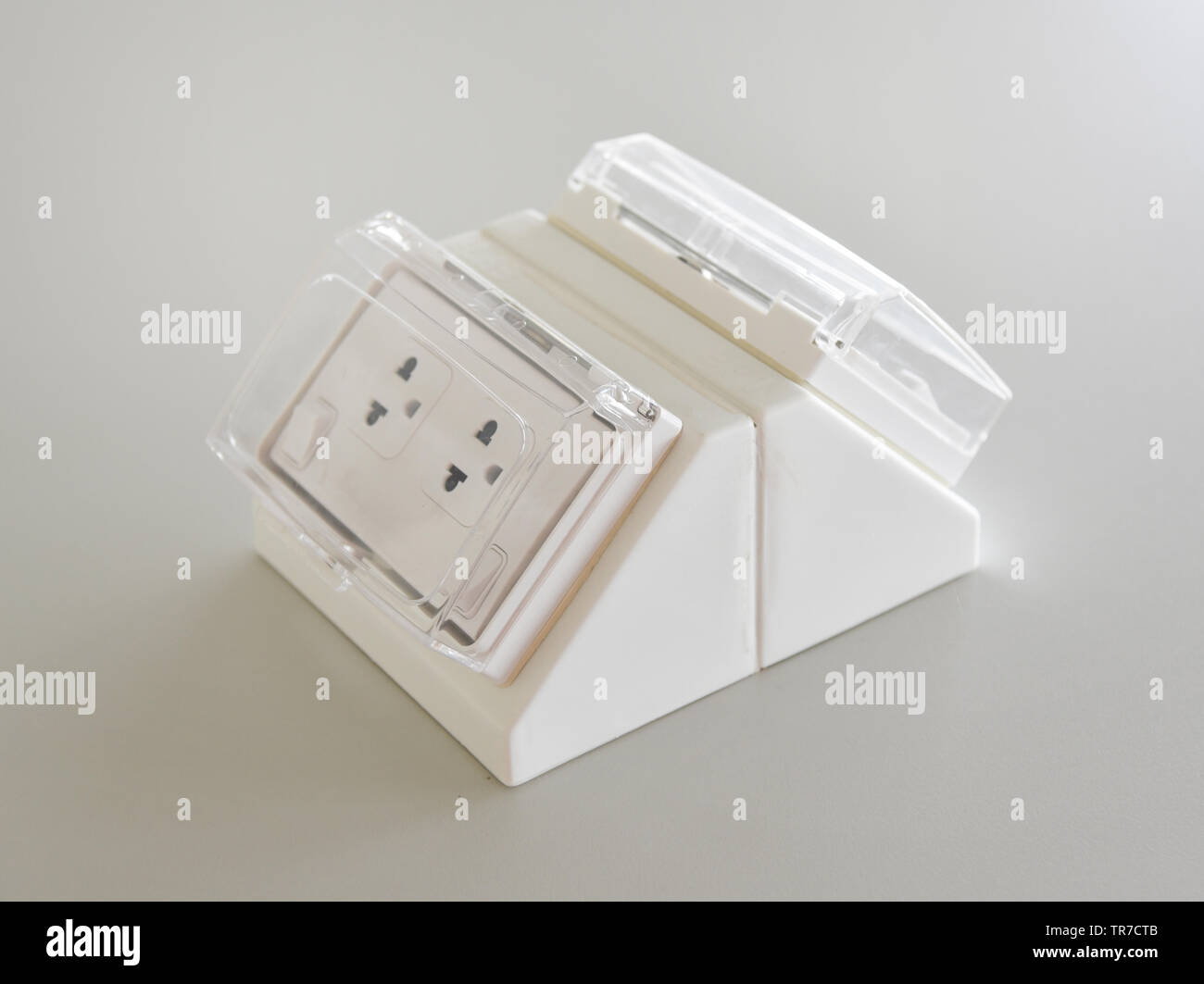 Electricity socket plug power electrical outlet on white table Stock ...