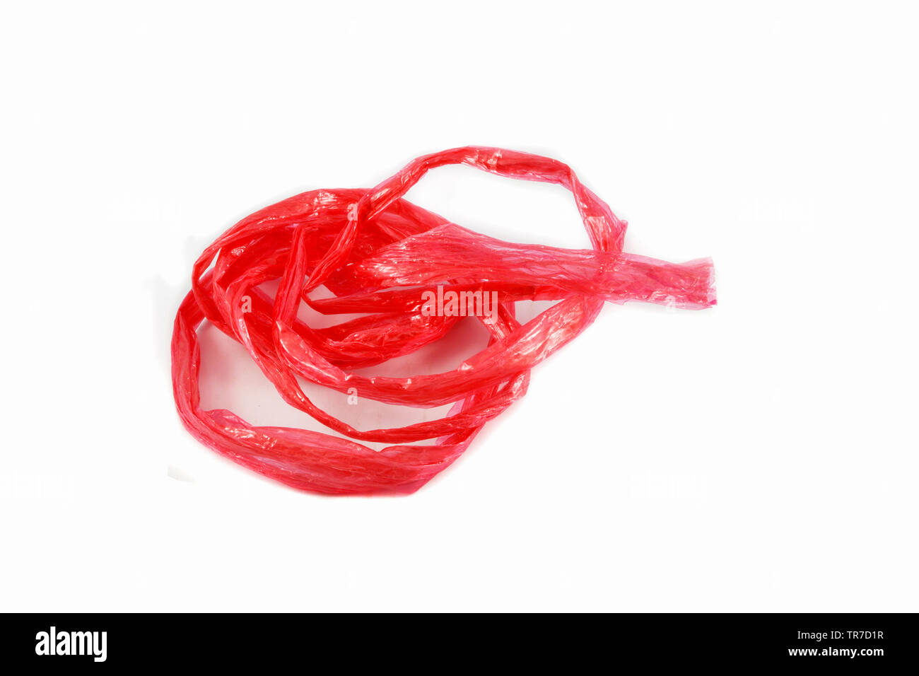 Red plastic rope isolated in white background Stock Photo - Alamy