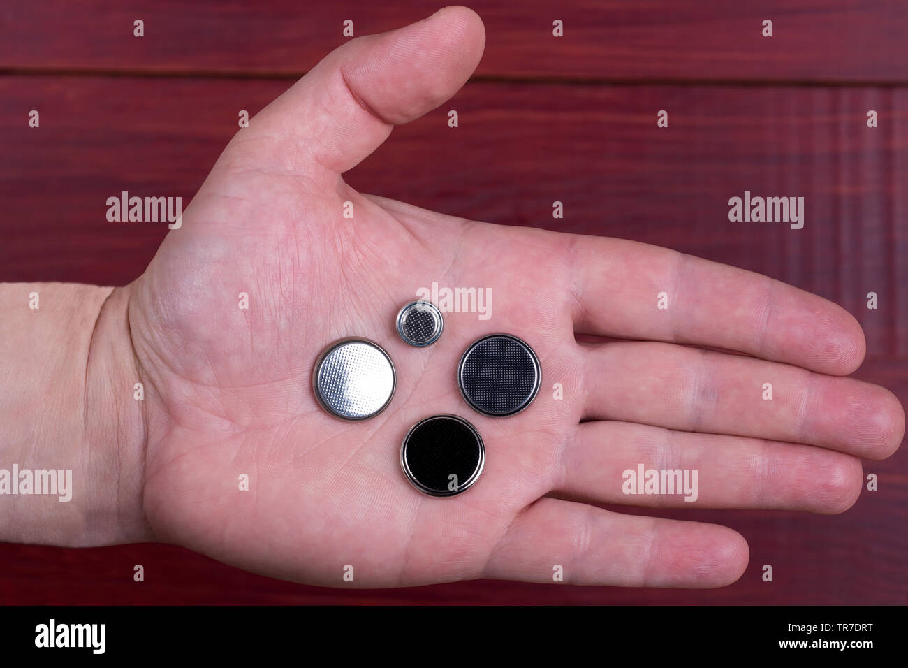 Batteries on the hand Stock Photo - Alamy