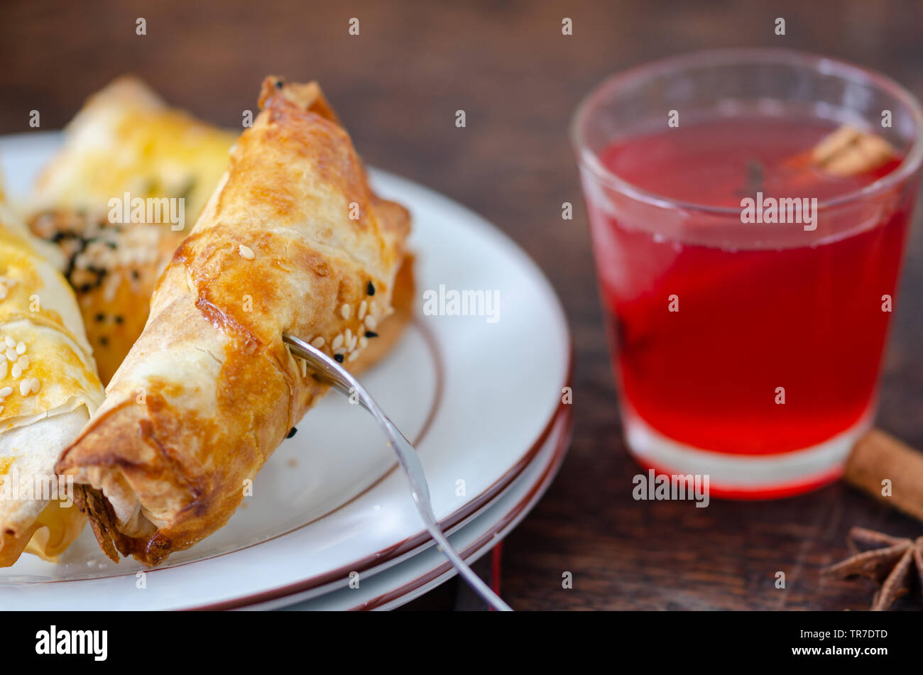 A glass of Turkish Sherbet and slices of freshly baked homemade borek ...