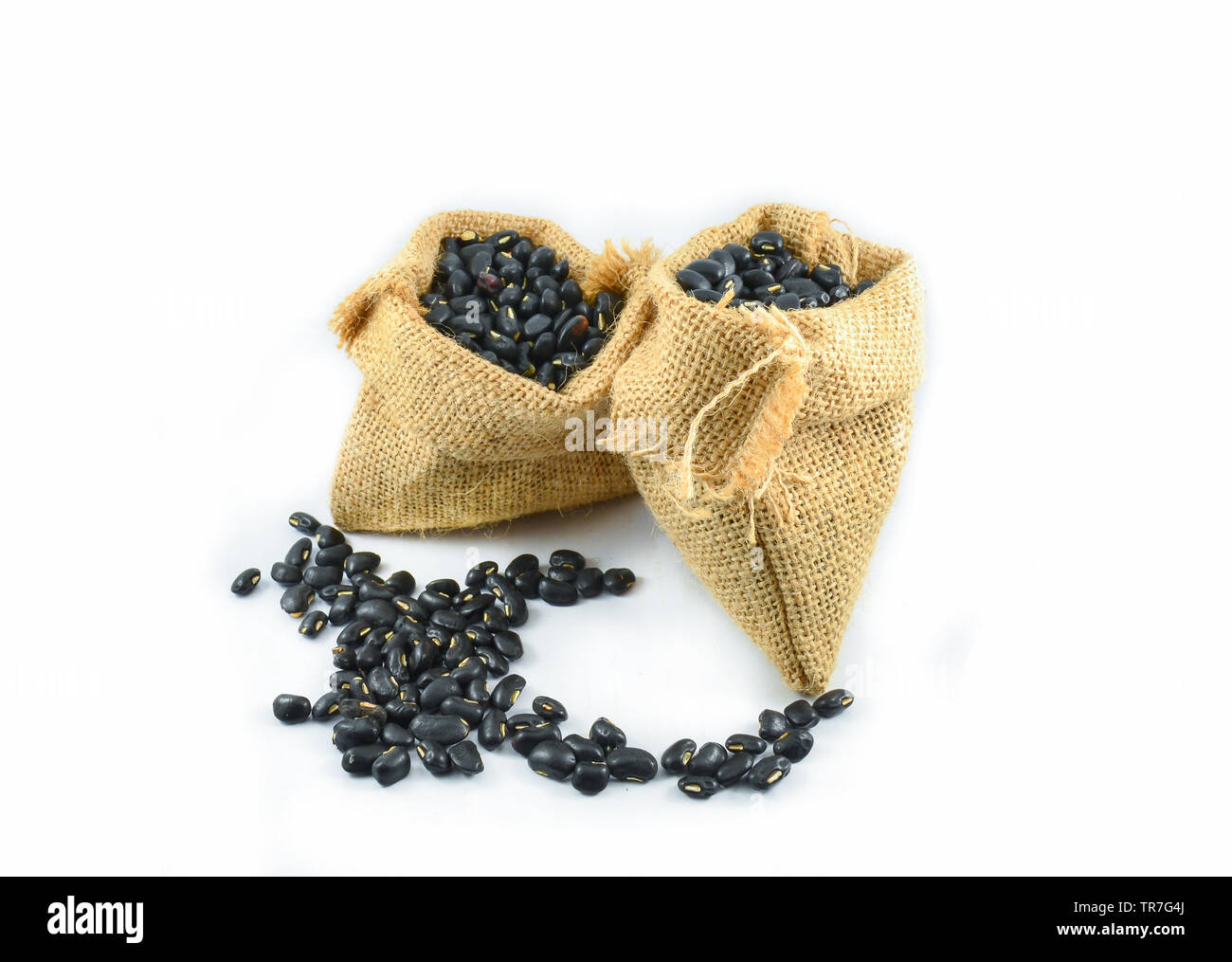 Black bean in sack isolated on white background Stock Photo - Alamy
