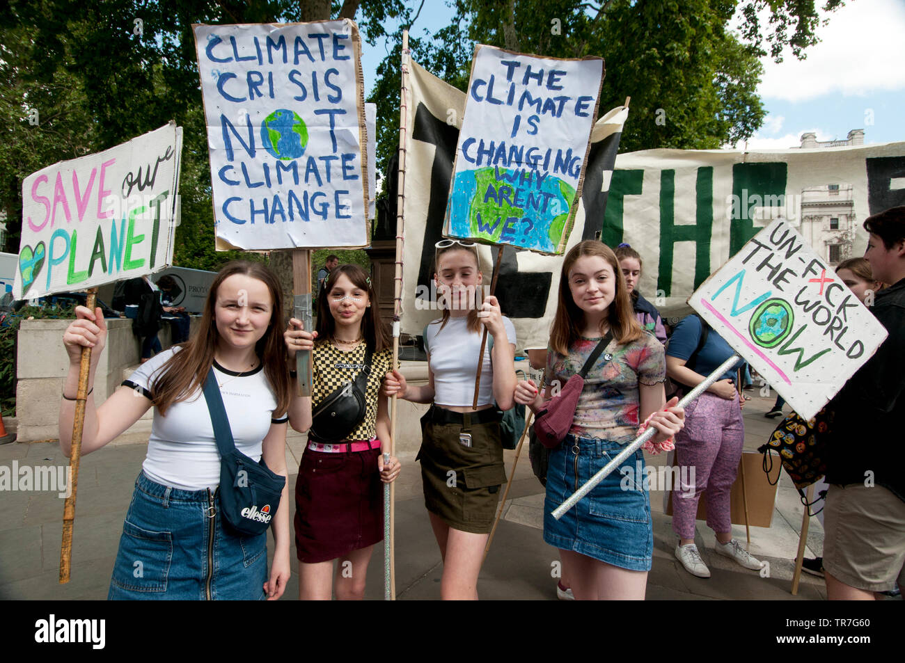 School Climate Strike, London, England, UK. A group of girls with home ...