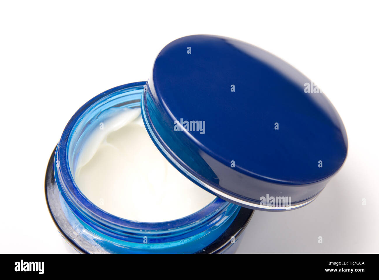 beauty skin cream in blue glass pot on white background Stock Photo - Alamy