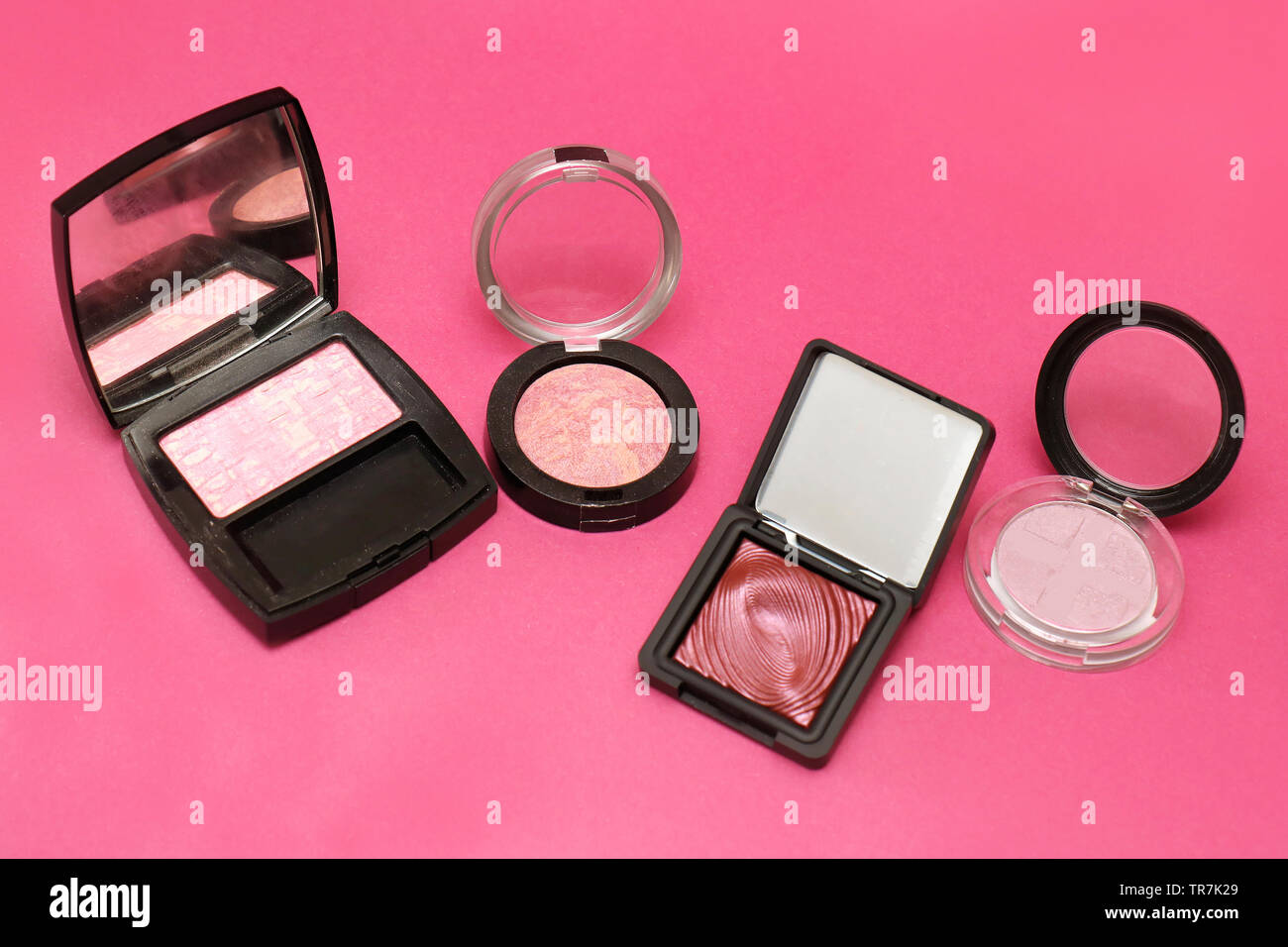 Modern beauty make up blush and eye shadow on pink background Stock ...
