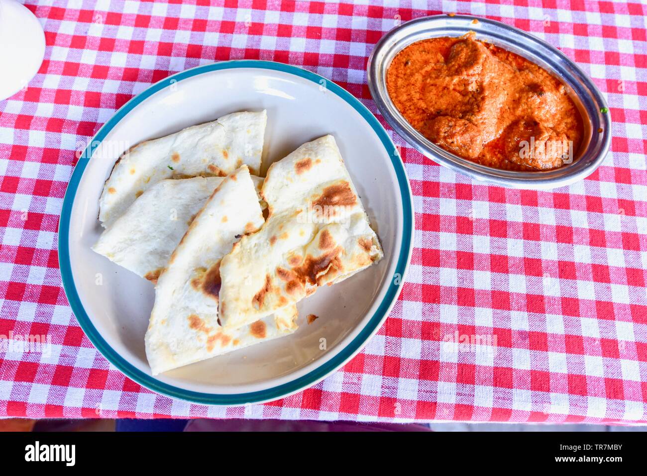 Top View of Chicken Tikka Masala with Indian Style Naan Breads Stock ...