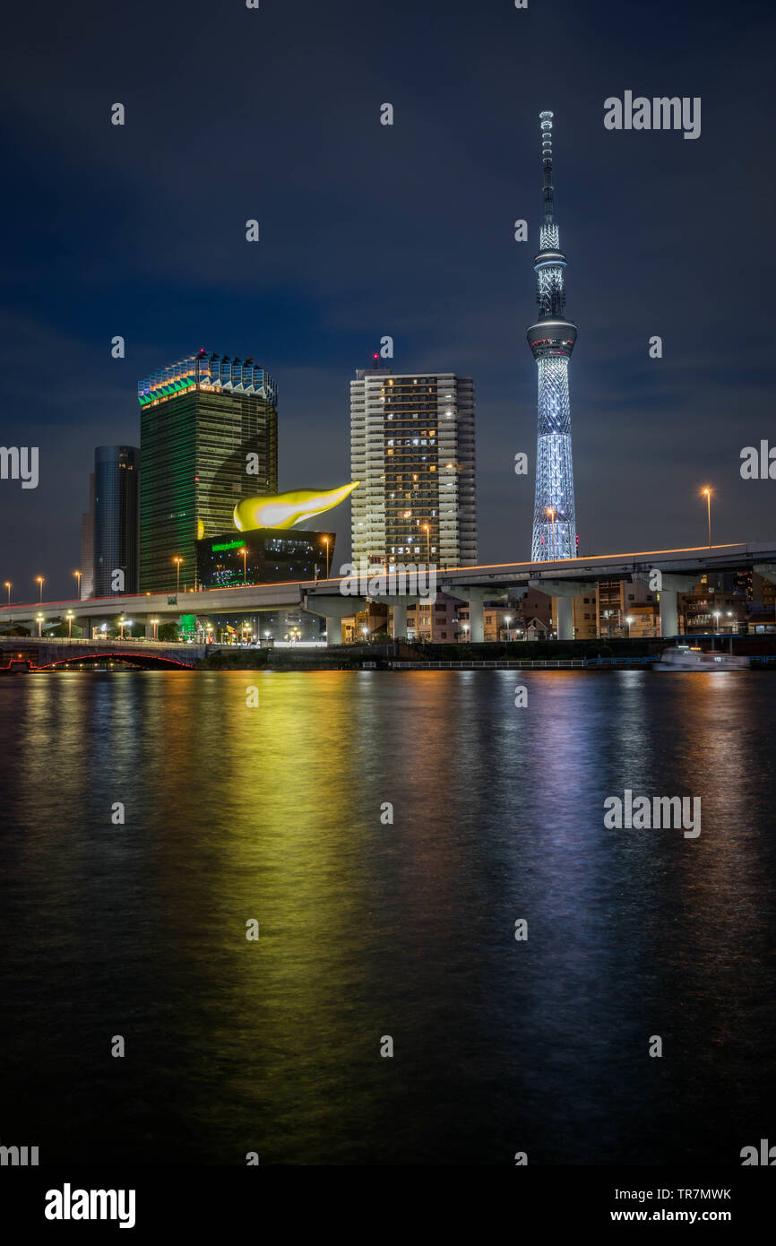 View of the Skytree Tower with the reflection in the river at night ...