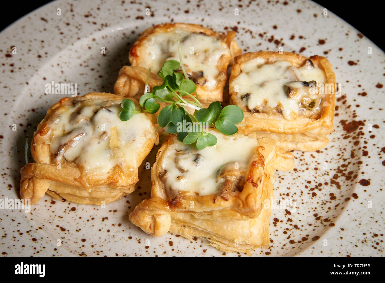 Baked stuffed puff pastry on a platter Stock Photo - Alamy