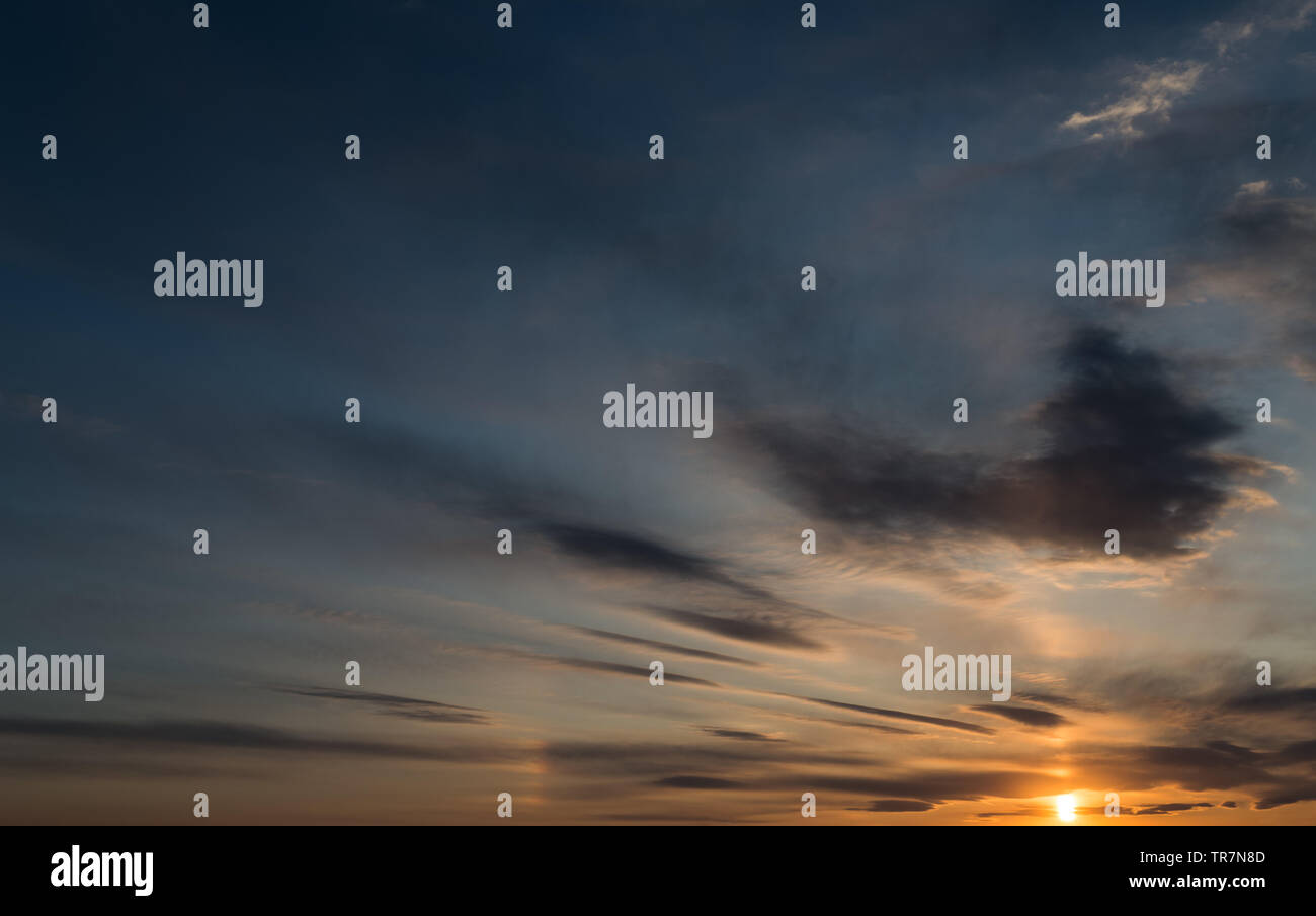 Dramatic sunset sky with dark clouds Stock Photo - Alamy